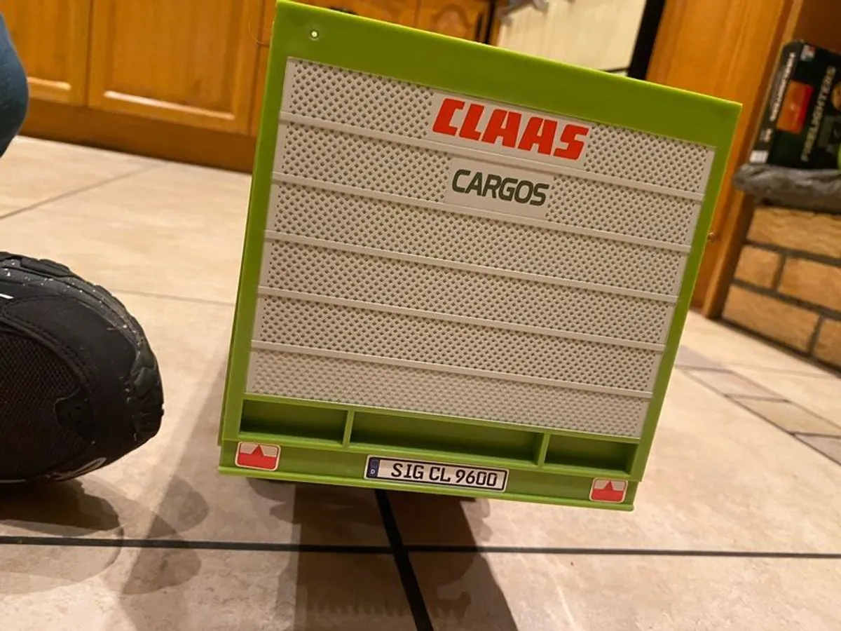 Claas remote control tractor with triaxle silage wagon for sale in Co ...